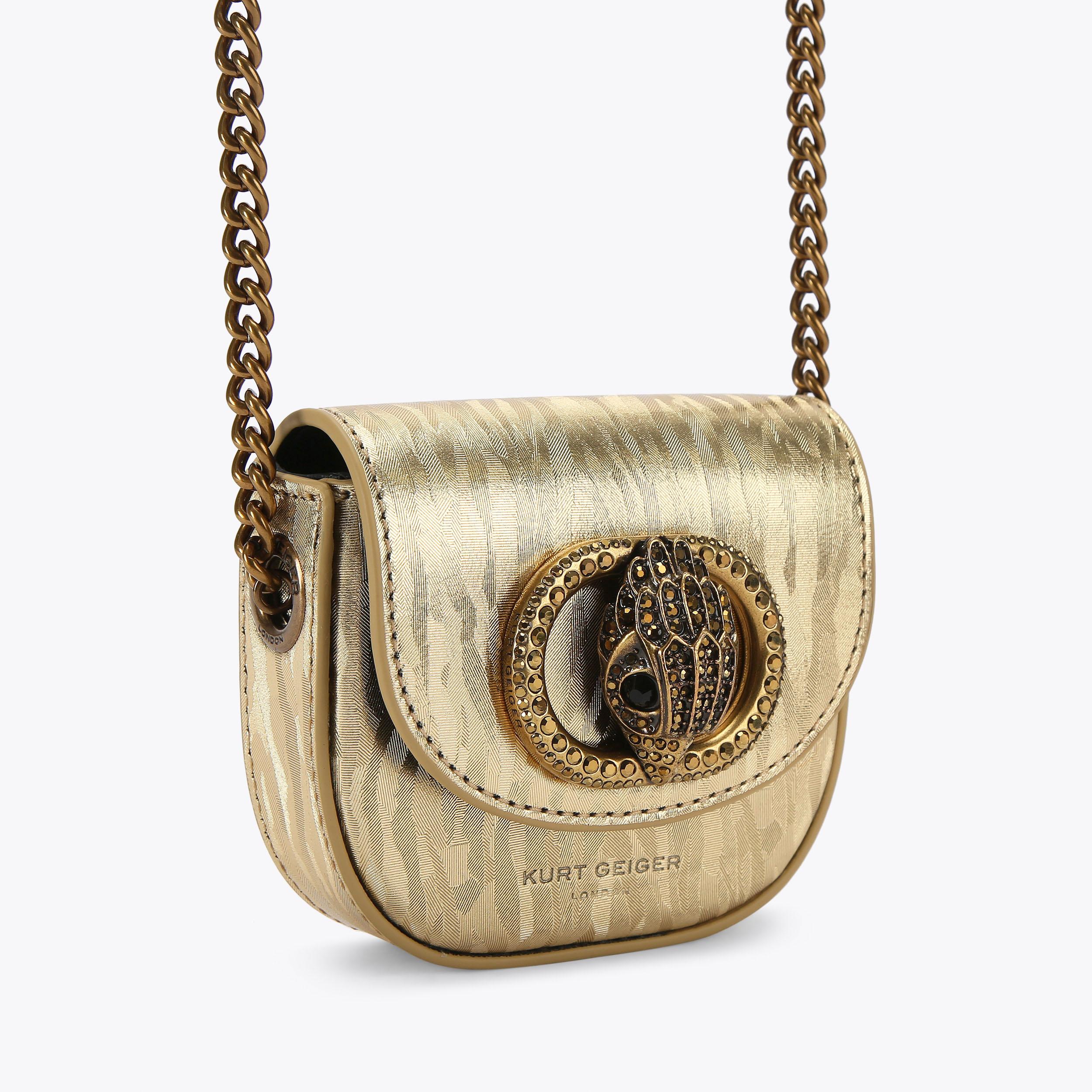 MICRO CHELSEA SADDLE Micro Gold Cross Body Bag by KURT GEIGER LONDON