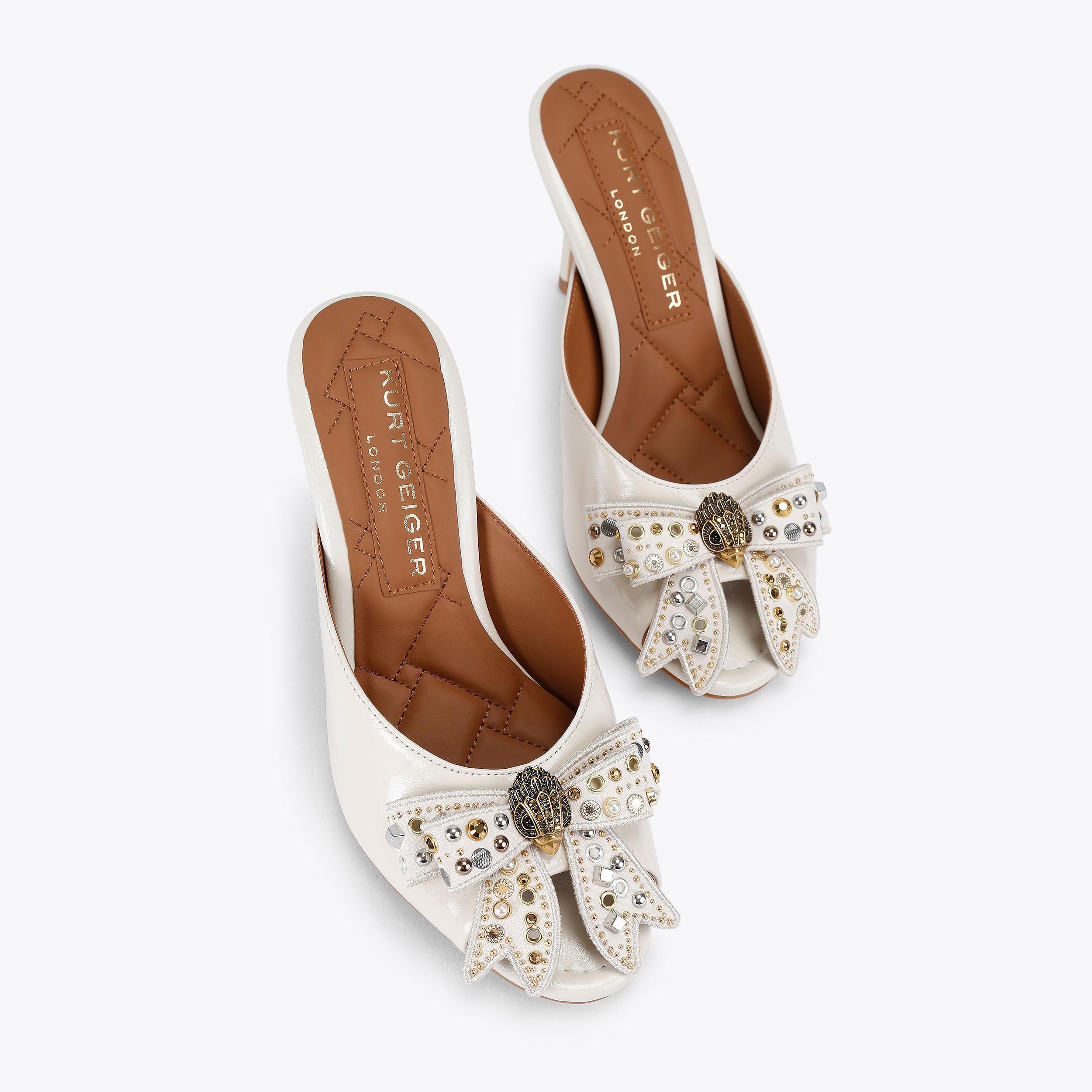 BELGRAVIA STUD BOW MULE Bone Patent Bow Mule Heels by KURT GEIGER LONDON