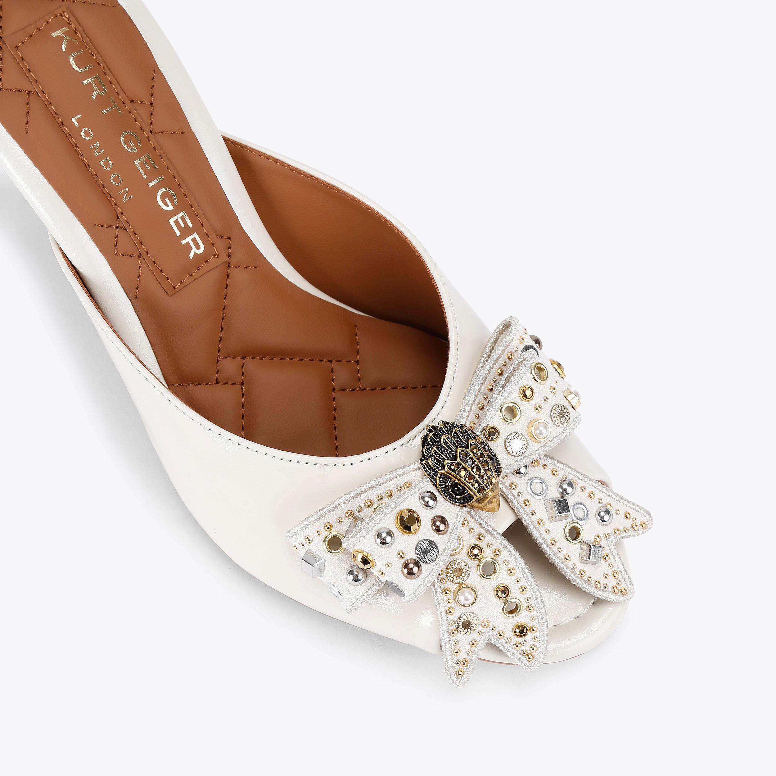 BELGRAVIA STUD BOW MULE Bone Patent Bow Mule Heels by KURT GEIGER LONDON